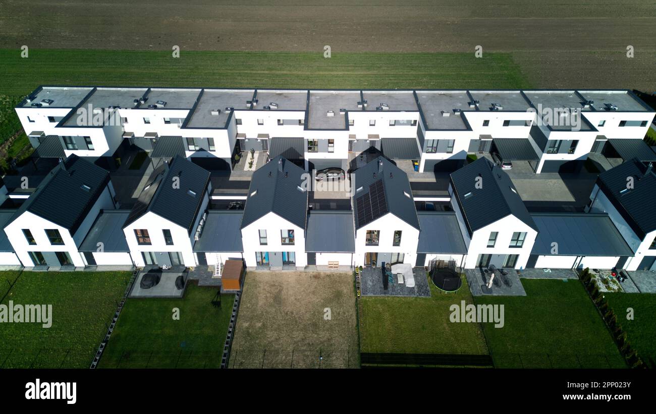 Aerial spring view of warm sunny neighbourhood community houses with ...