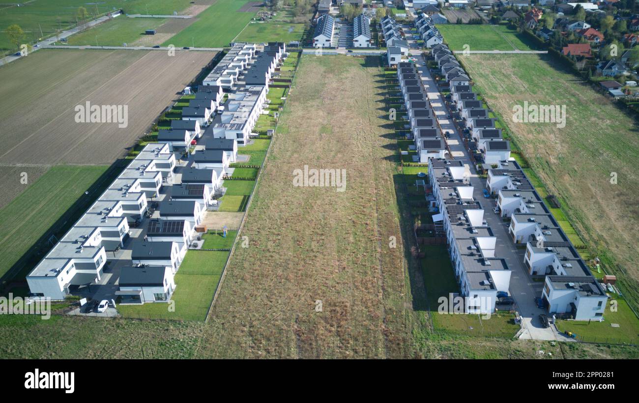 Aerial spring view of warm sunny neighbourhood community houses with ...