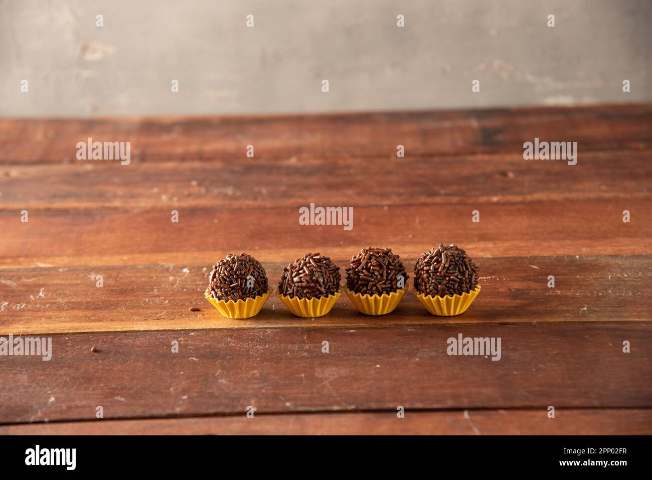 Brigadeiro (Brigadeiro) Traditional Brazilian sweet. Lined up on a ...