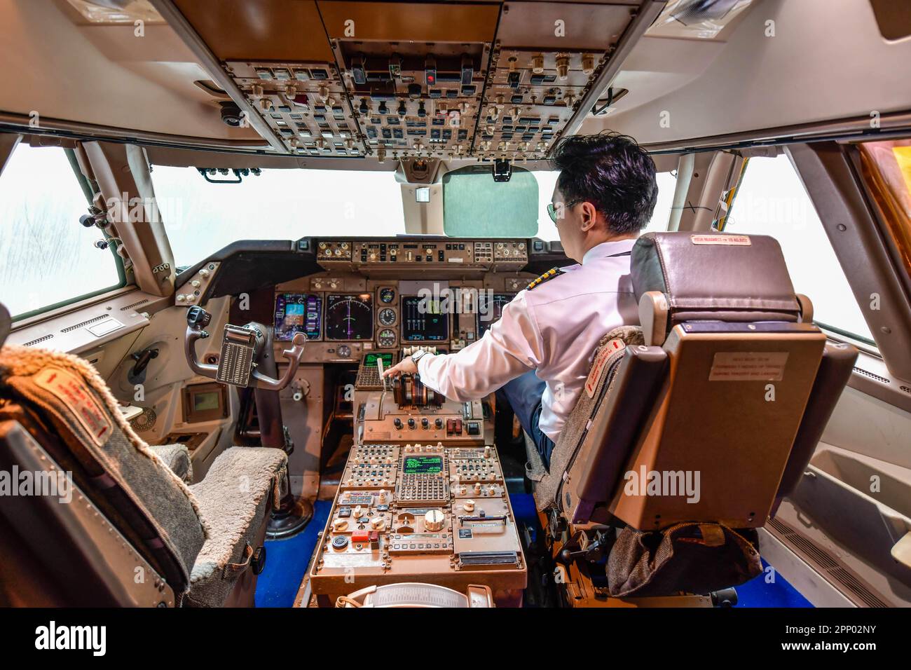 Airline pilot work in the cockpit Stock Photo - Alamy