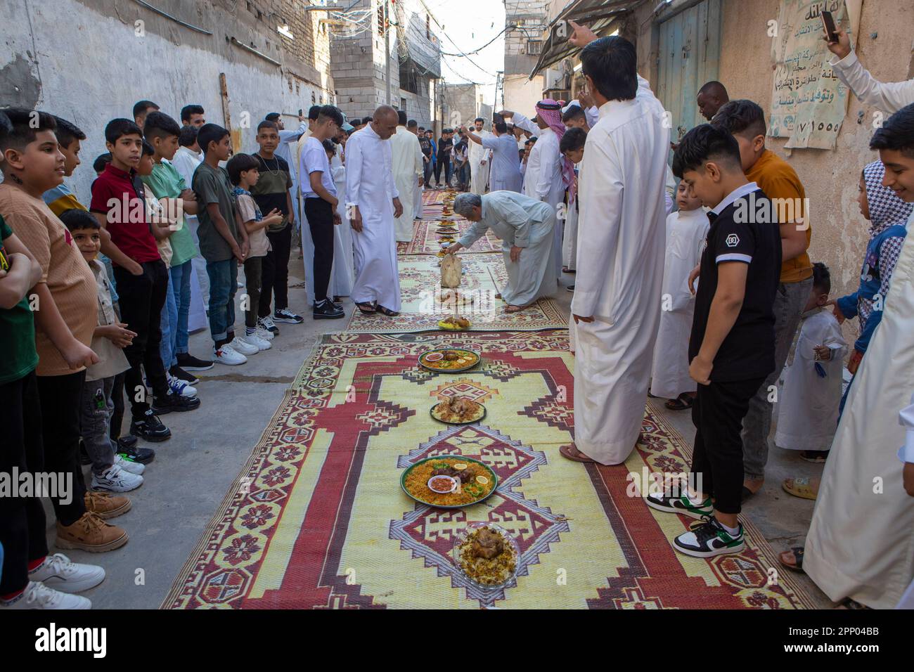 Iraqis eat morning breakfast on the first day of Eid Al-Fitr holiday in ...