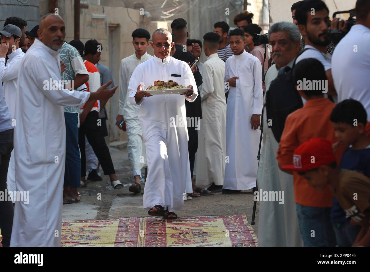 Iraqis eat morning breakfast on the first day of Eid Al-Fitr holiday in ...