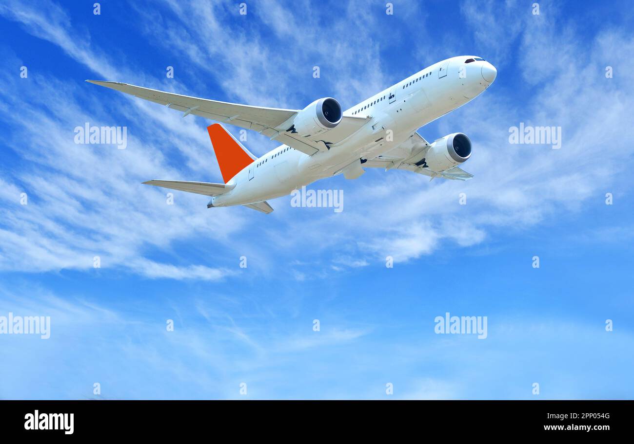 Flight of the plane in the sky Stock Photo - Alamy