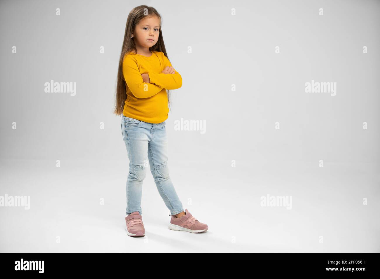 Full length of adorable six years old girl isolated on white studio ...