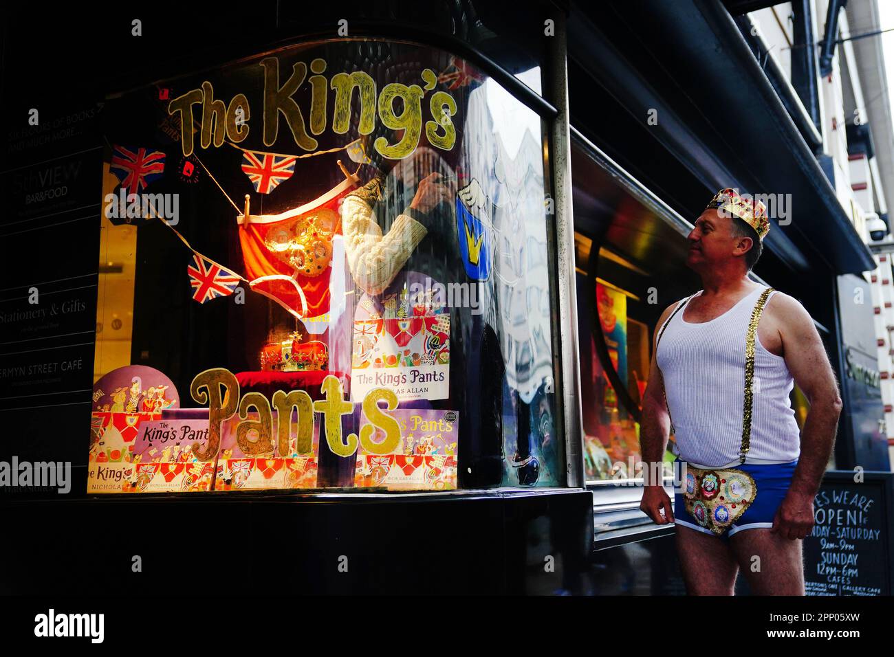 A man dressed in pants poses as Nicholas Allan, award-winning author ...