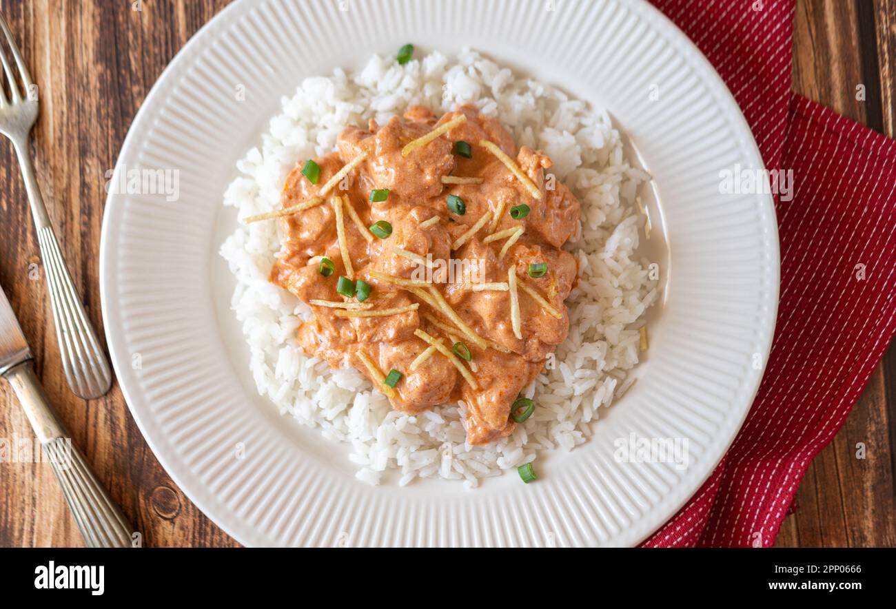 Brazilian strogonoff in plate with rice and potato straw Stock Photo ...