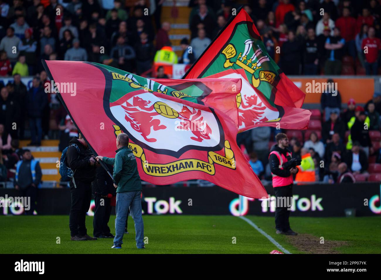 Banners are waved on the pitch before the National League soccer match ...