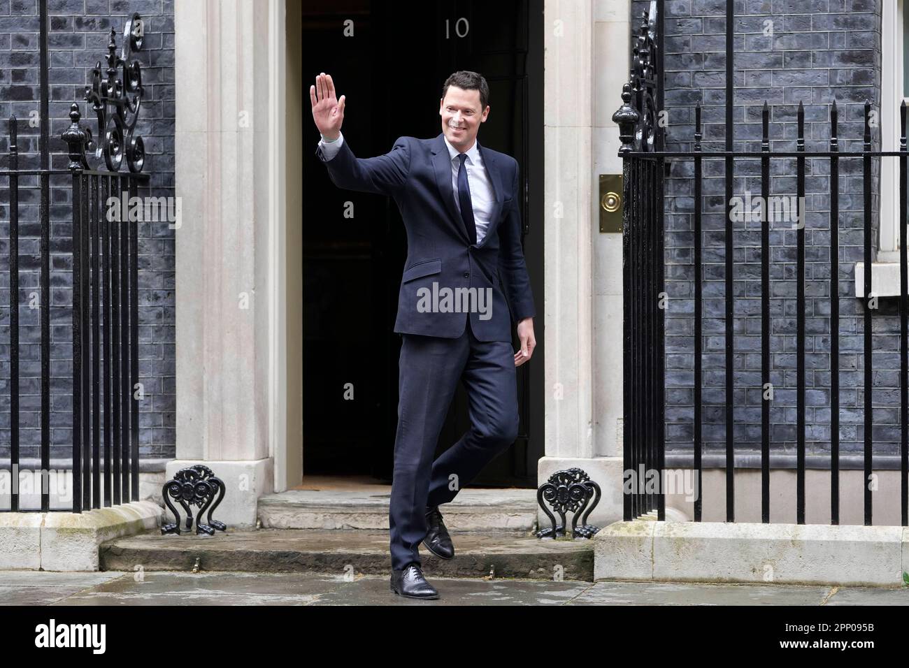 Alex Chalk, Britain's newly appointed Justice Secretary waves as he ...