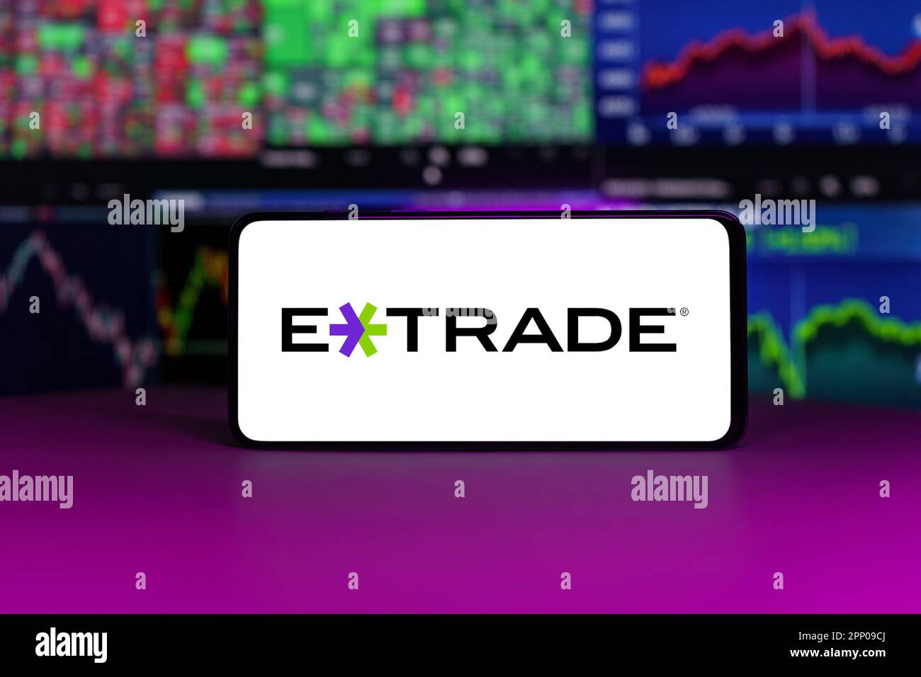 E-Trade on stock market index in front of stock market charts background Stock Photo - Alamy