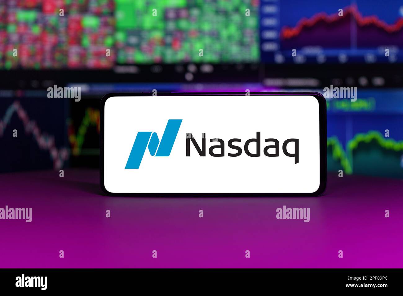 nasdaq stock market index in front of stock market charts background ...