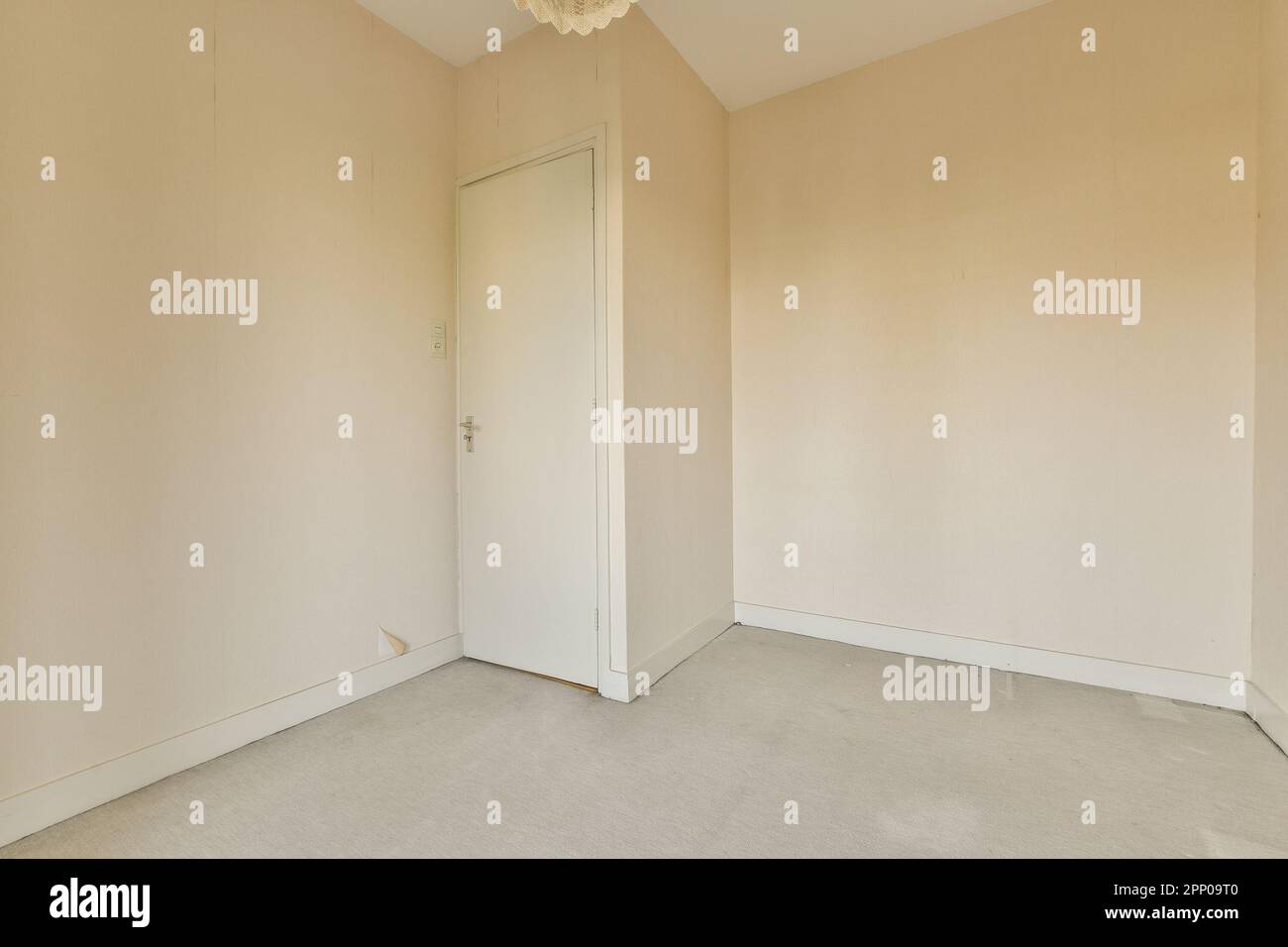 an empty room with white walls and no one door on the other wall in ...