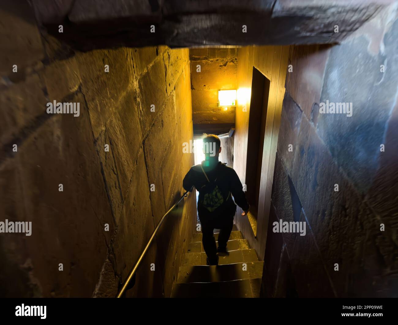 A lone man stands in the darkness of a labyrinthine cave, discovering ...