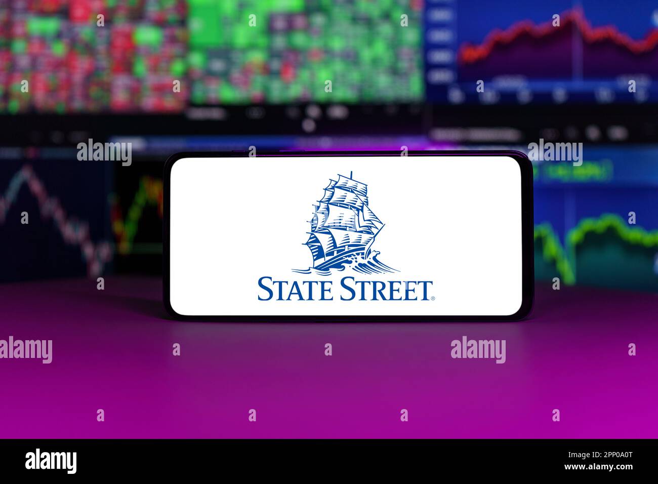 State Street on stock market index in front of stock market charts ...
