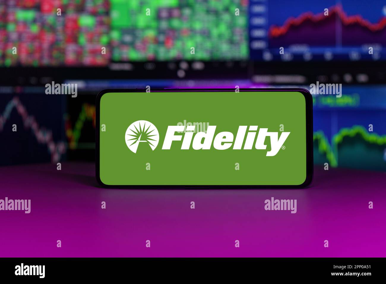 Fidelity on stock market in front of stock market charts background ...