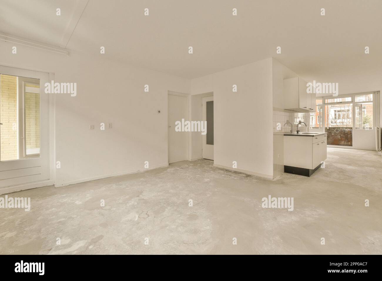 an empty room with white walls and no one person standing in the ...