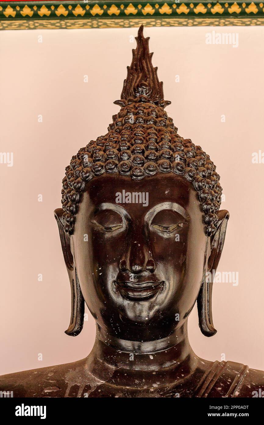 Black Buddha that is unique in carving Stock Photo - Alamy