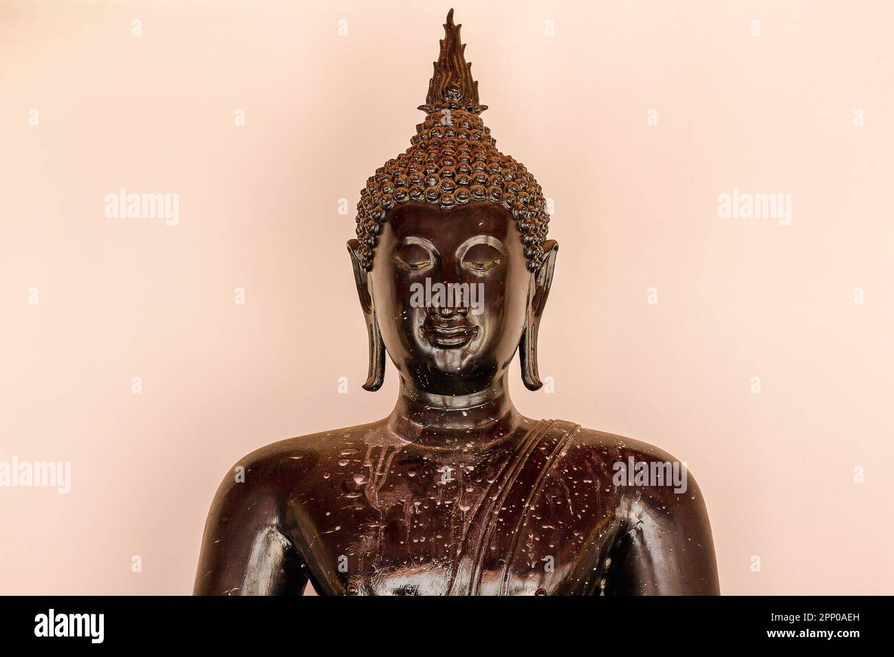 Black Buddha that is unique in carving Stock Photo - Alamy
