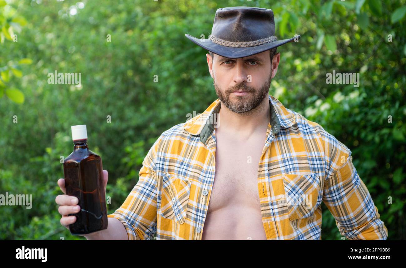 cowboy man with whiskey. cowboy man with whiskey bottle. cowboy man ...