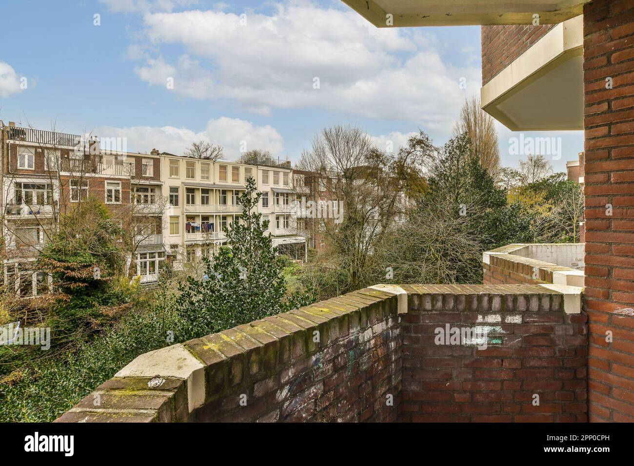 an outside area with buildings and trees on the other side, taken from ...