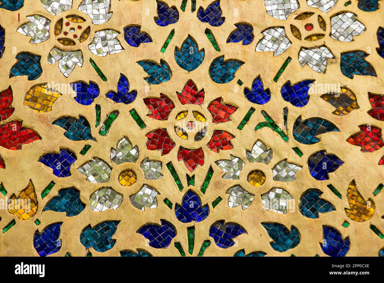 Multi-colored glass decorated on the wall of the temple in Thailand ...