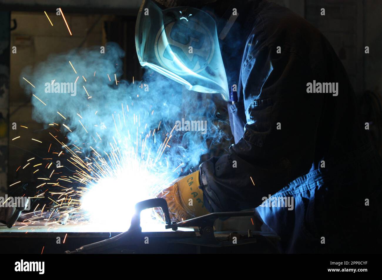 Welder in Blue Stock Photo - Alamy