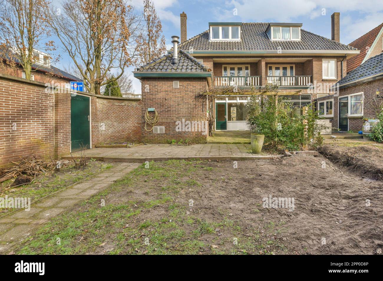 an empty yard in the middle of a residential area, with no grass or ...