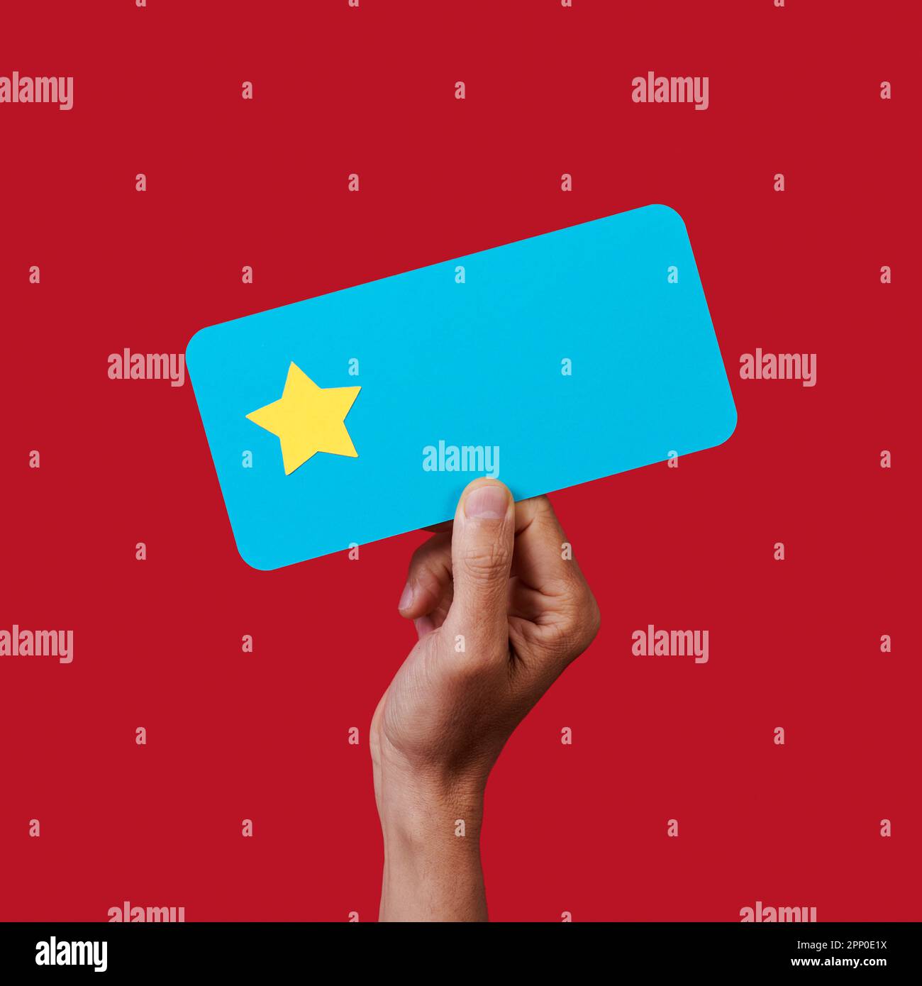 a man holds a blue sign with a single star, from a five star rating ...