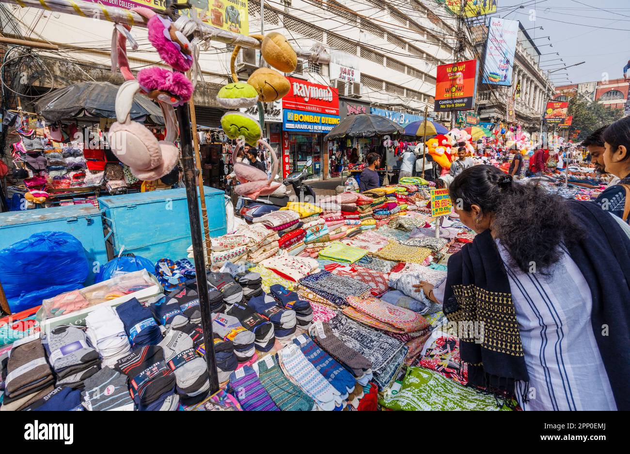 A roadside stall selling clothes and fabrics in the street in the New ...