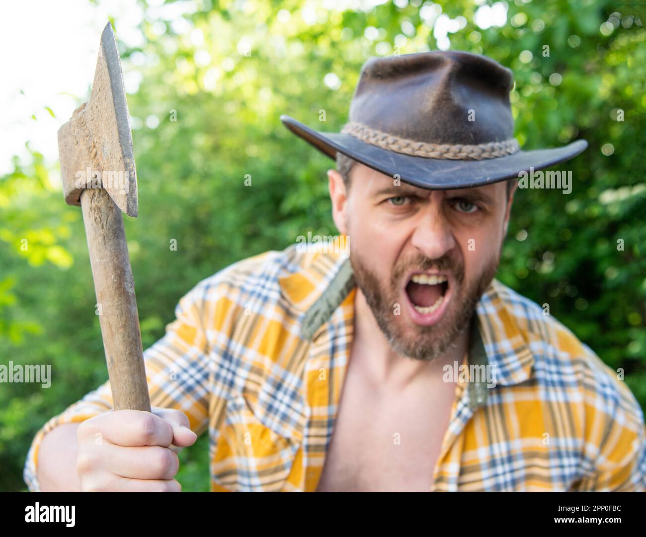 angry lumberjack with axe in selective focus. angry lumberjack with axe ...