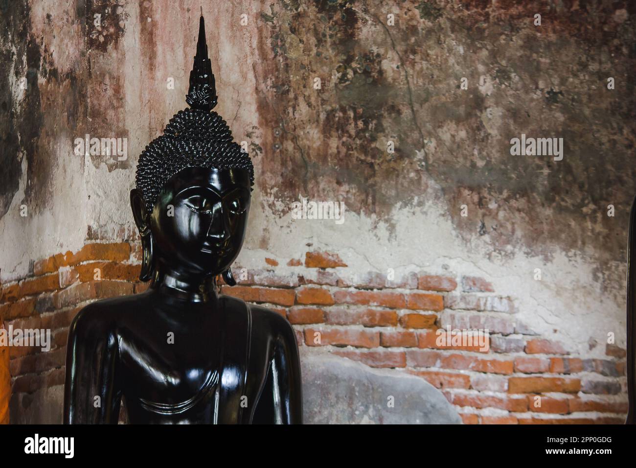 Black buddha statue with old walls in Thai temples Stock Photo - Alamy
