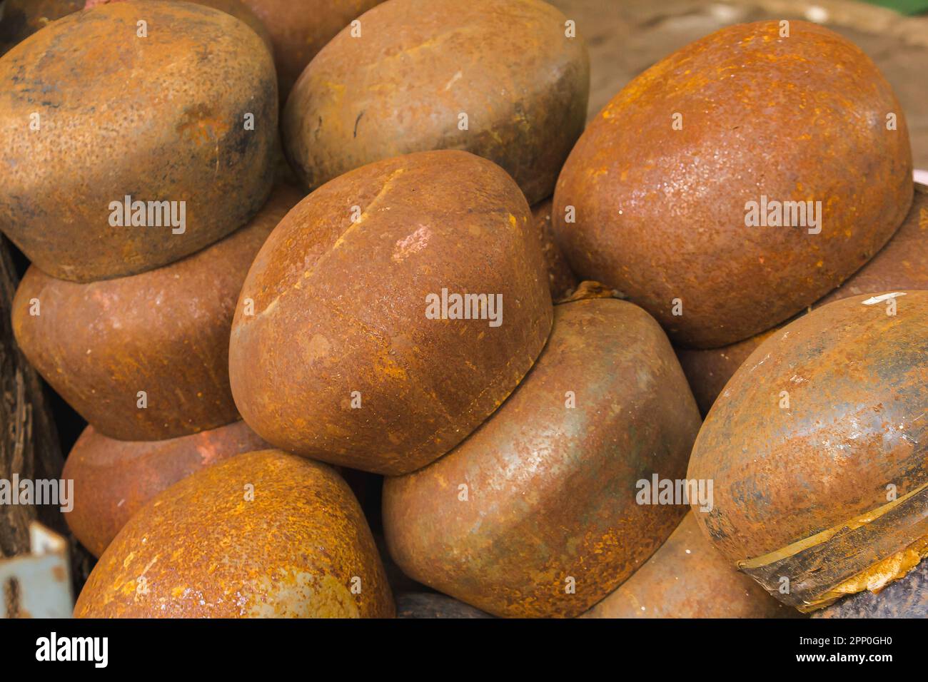 old rusted alms-bowl, stacked together Waiting for decoration to be ...