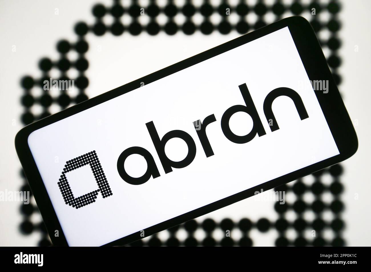 In this photo illustration, Abrdn plc logo is seen on a smartphone ...