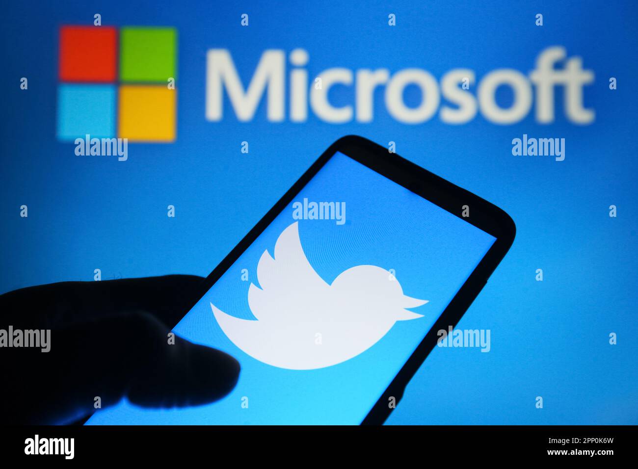 In this photo illustration, Twitter logo is seen on a smartphone and ...