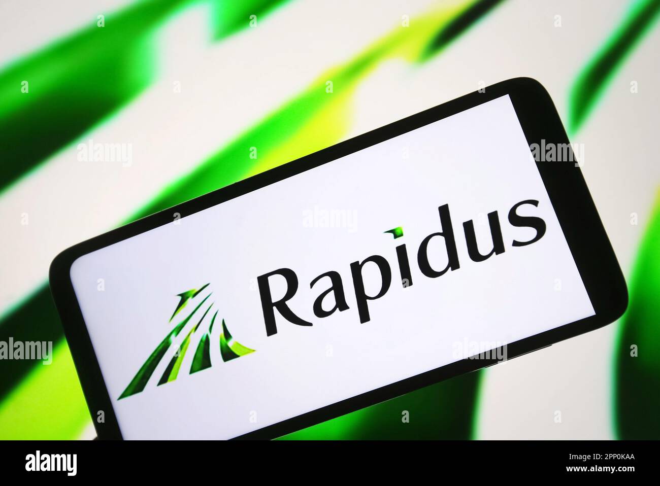 In this photo illustration, Rapidus Corporation logo is seen on a smartphone screen Stock Photo ...