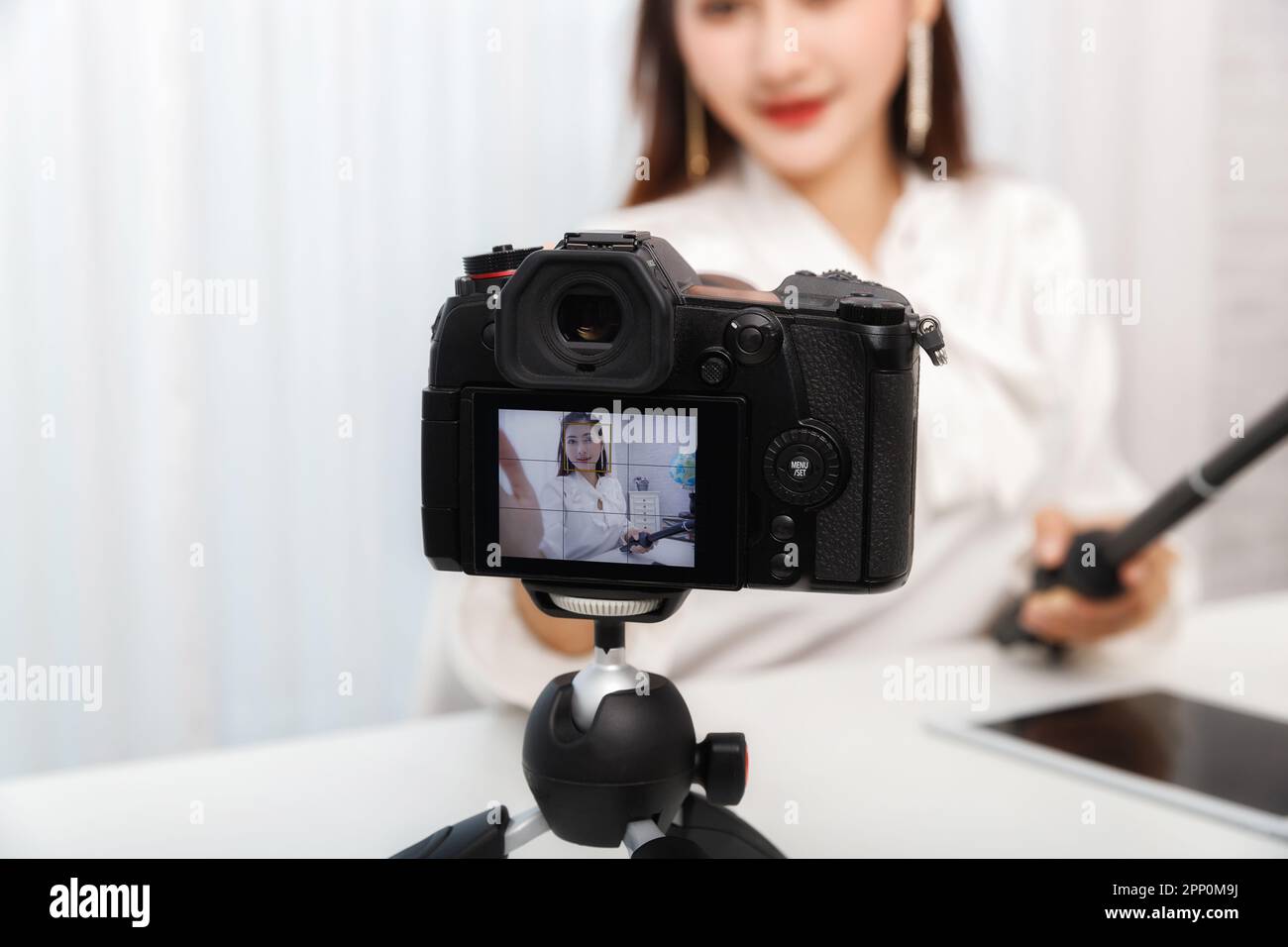 Young asian woman traveler blogger selfie herself with smart phone ...