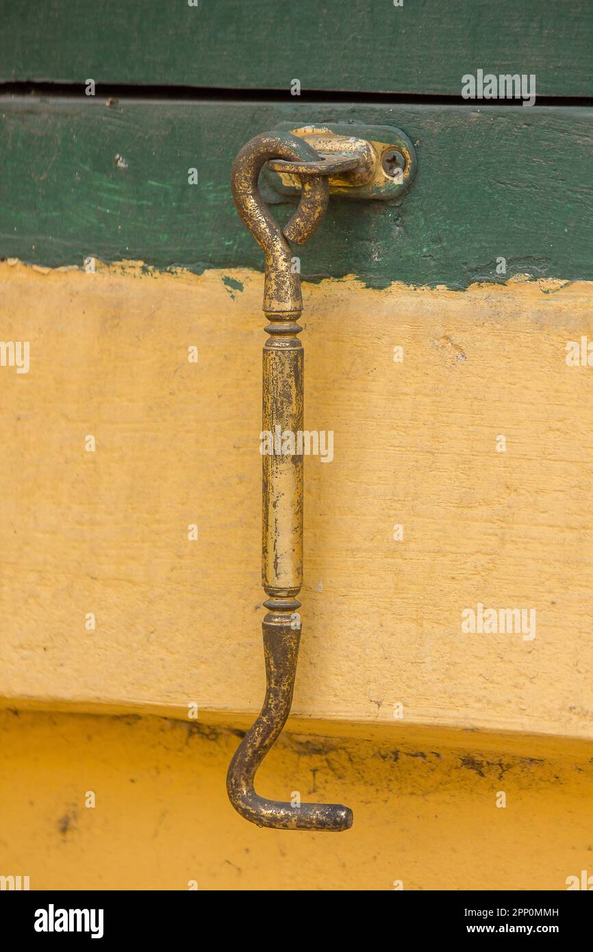 hook old brass window Used to attach doors or windows Stock Photo - Alamy