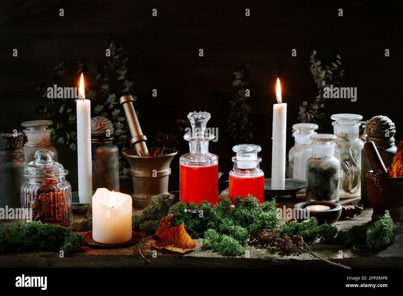 Witchcraft still life concept with potion, herbs ingredients candles ...