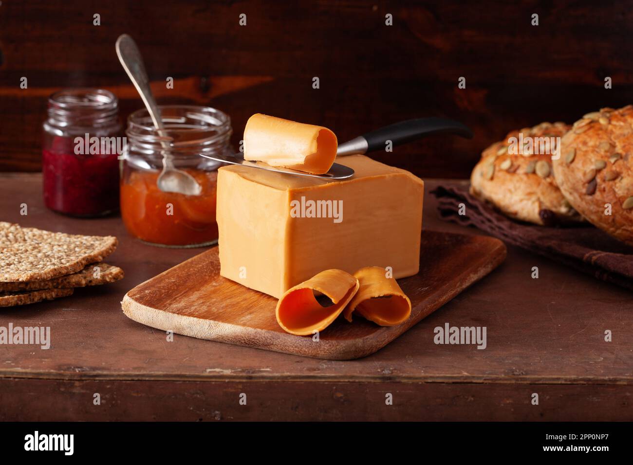 Norwegian brunost traditional brown cheese on rustic background Stock ...