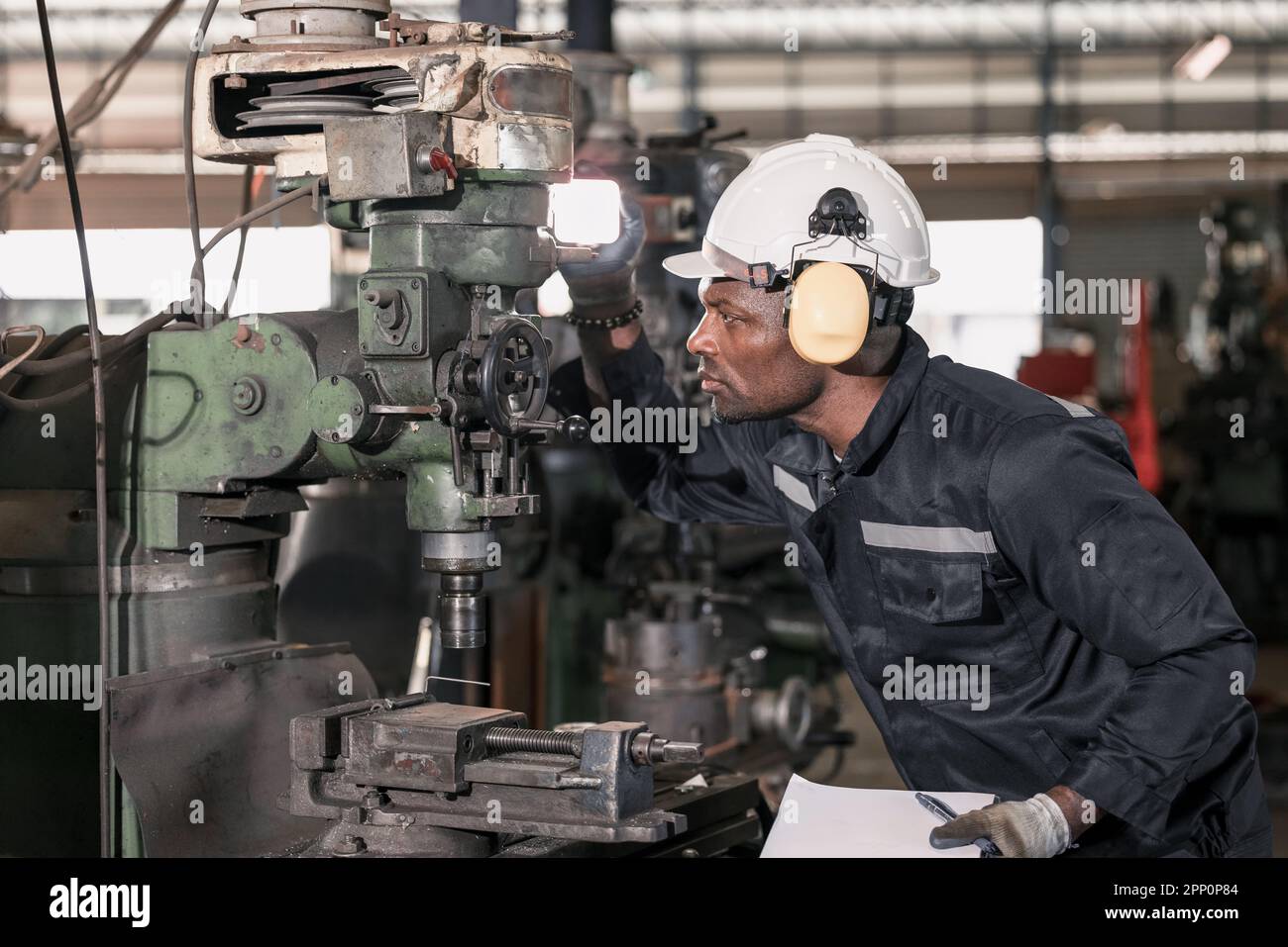 Skilled robotic technician spots the light on robotic components to do ...
