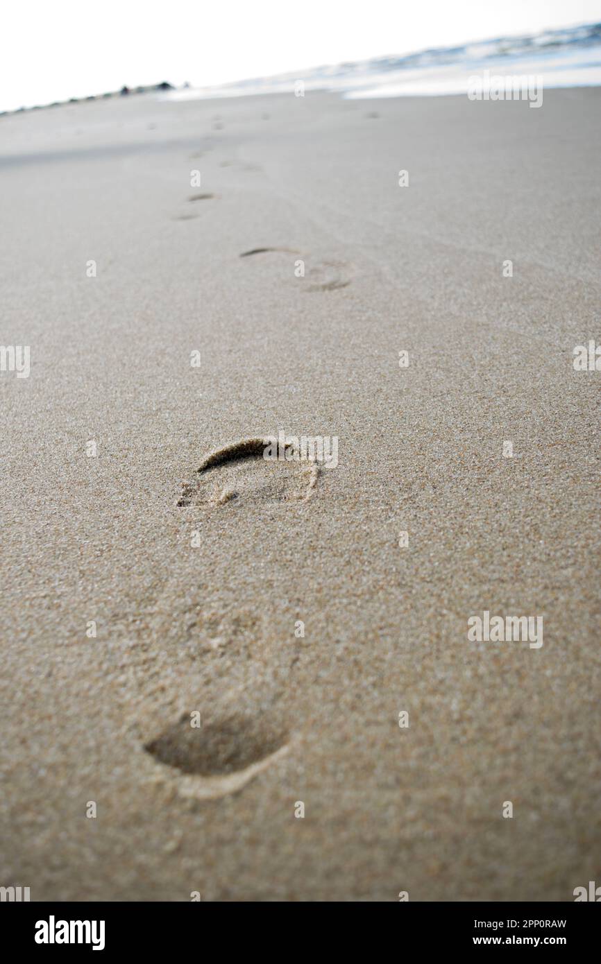 View of a shoe footprint in the sand Stock Photo - Alamy