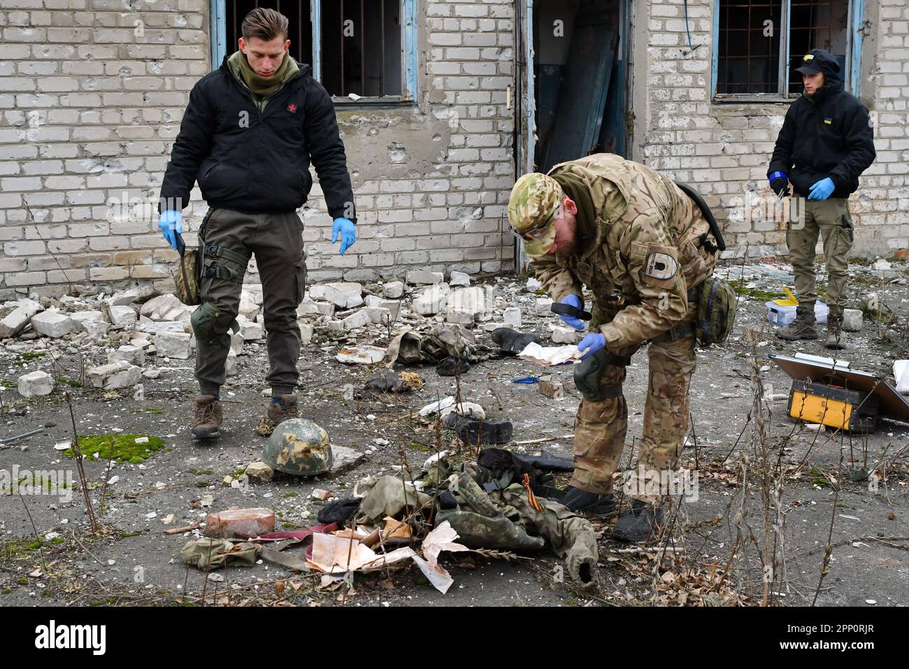 The Black Tulip group members examine the remains of one of Russian ...