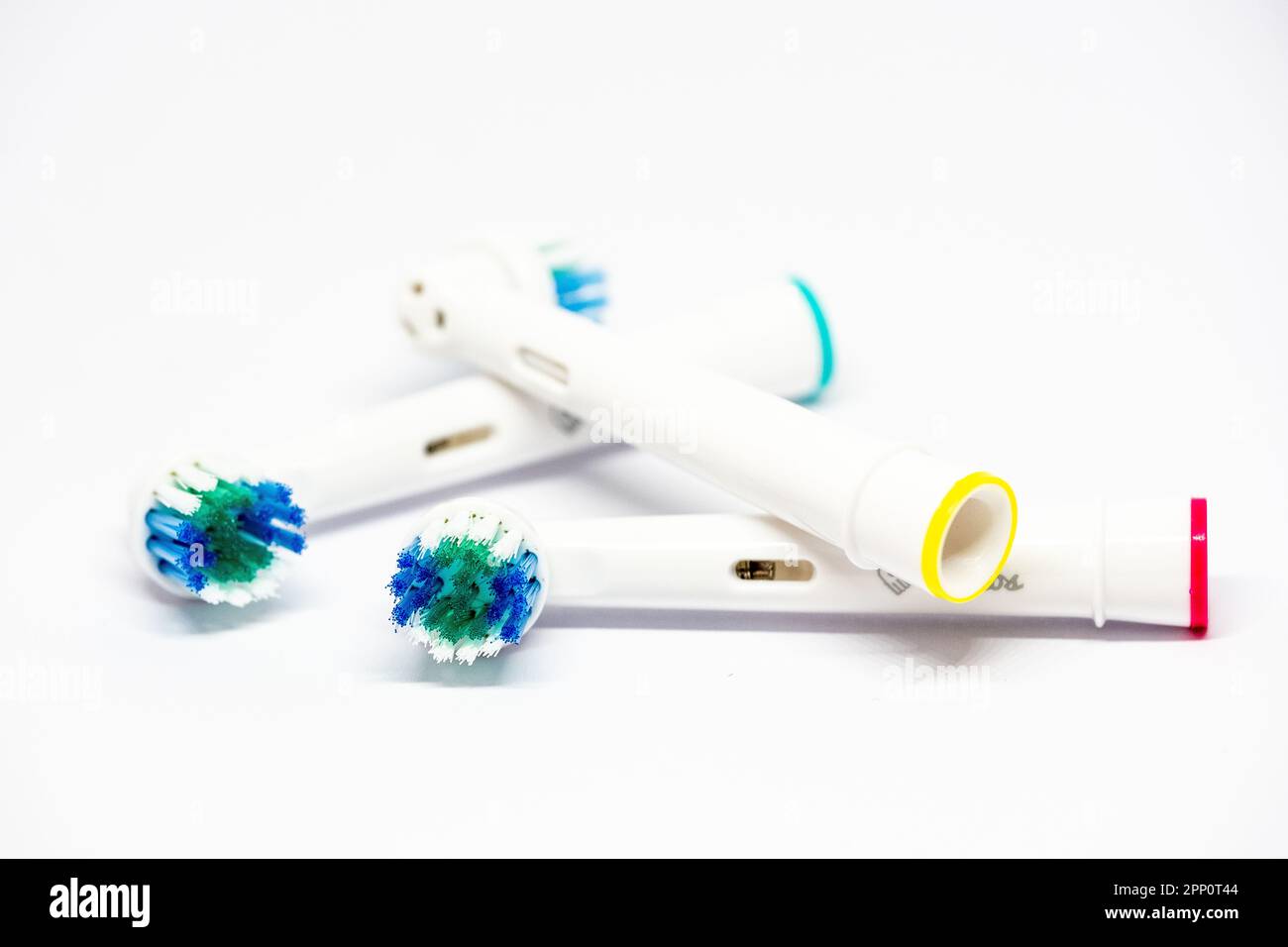 Three interchangeable heads for a electric toothbrush Stock Photo - Alamy