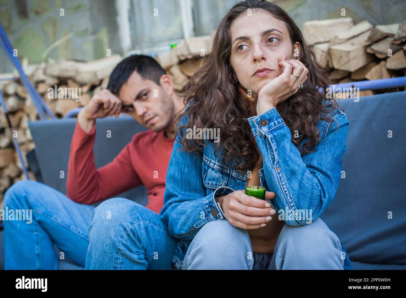 Very drunk couple, a boy and a girl, drink a strong alcoholic drink ...