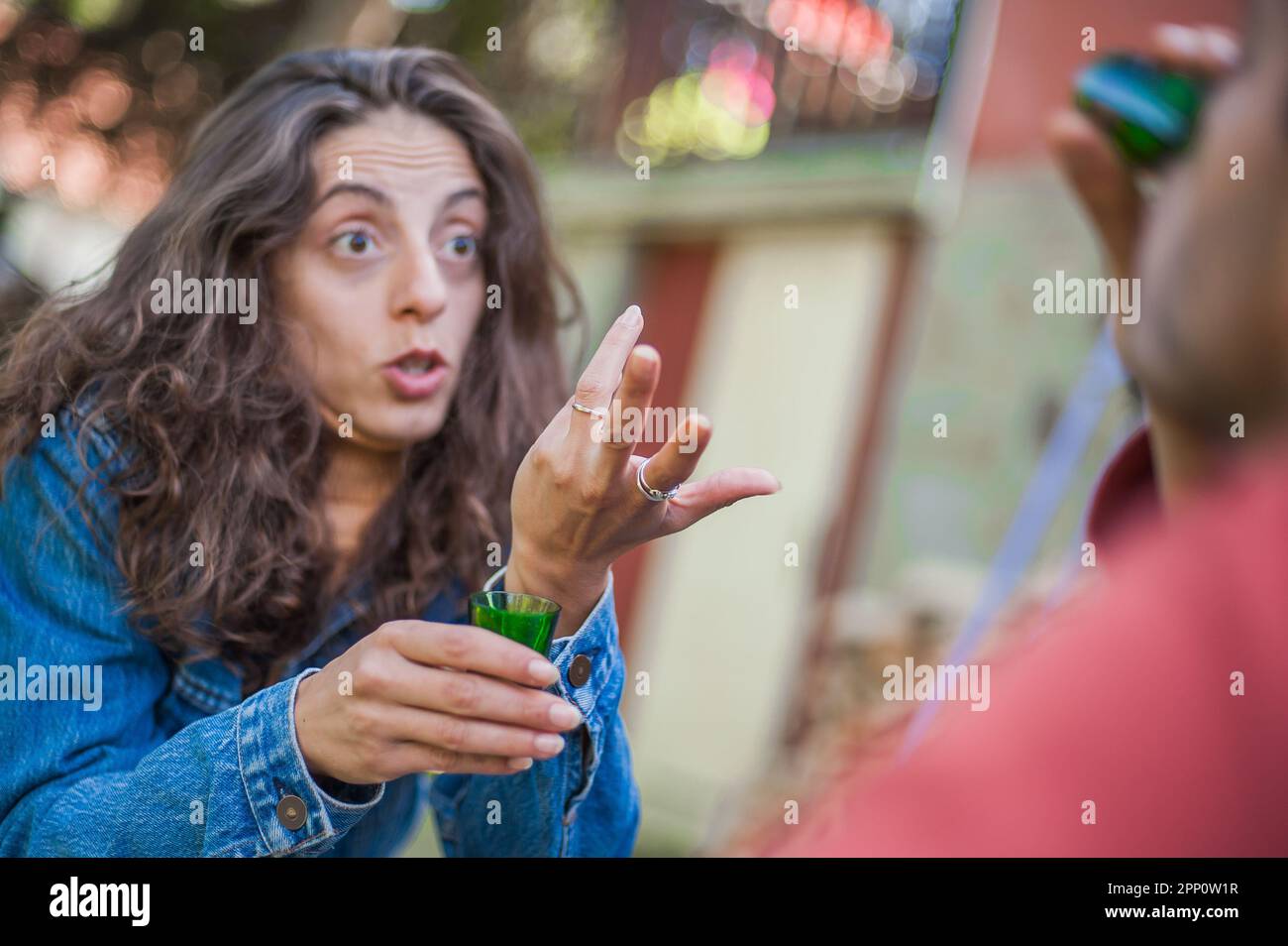 Very drunk couple, a boy and a girl, drink a strong alcoholic drink ...