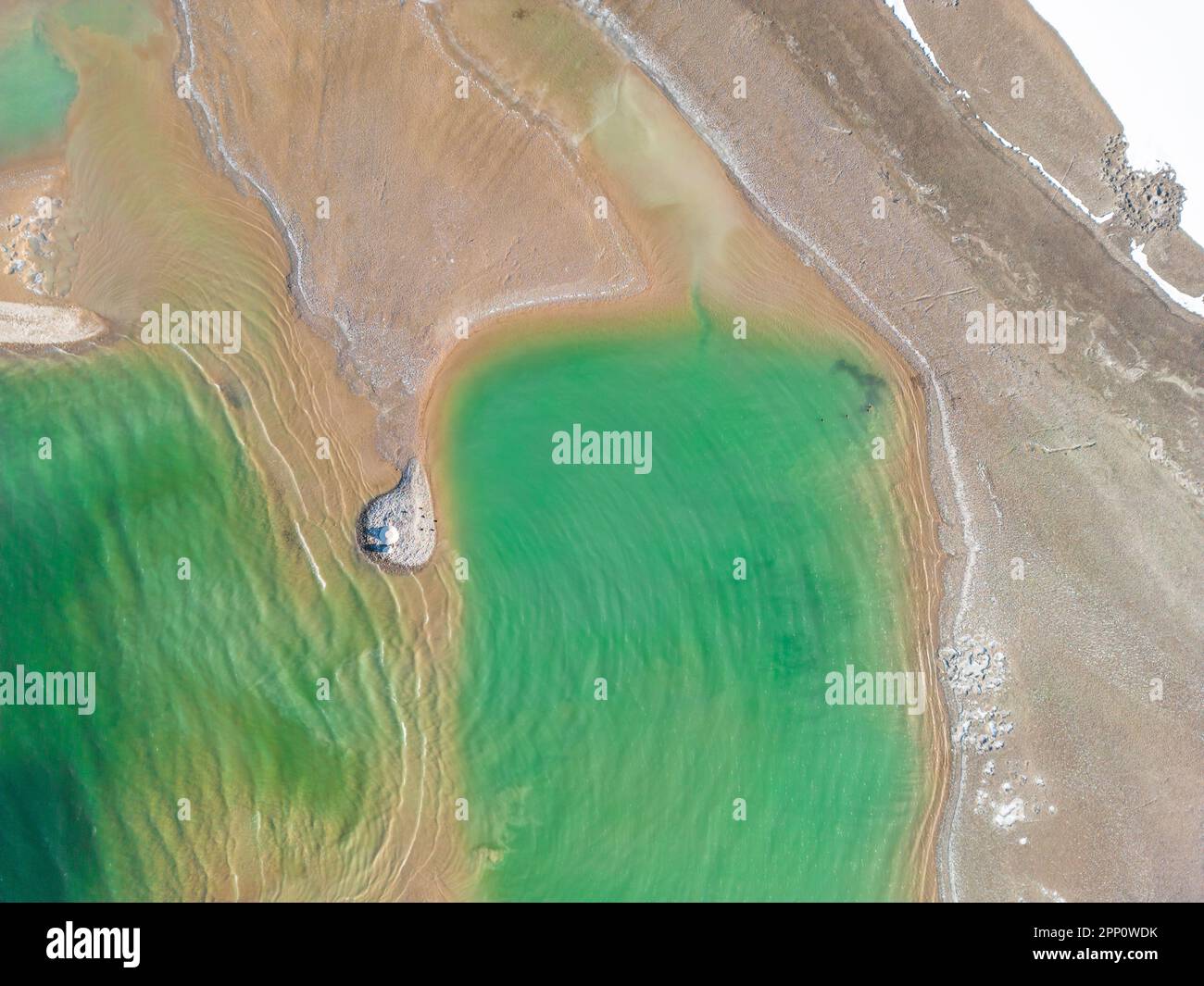 An aerial view of a stunning seascape with emerald green sea in ...