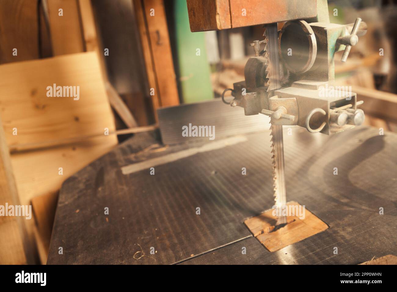 Wide-angle view of an upright bandsaw with its table top ready with ...