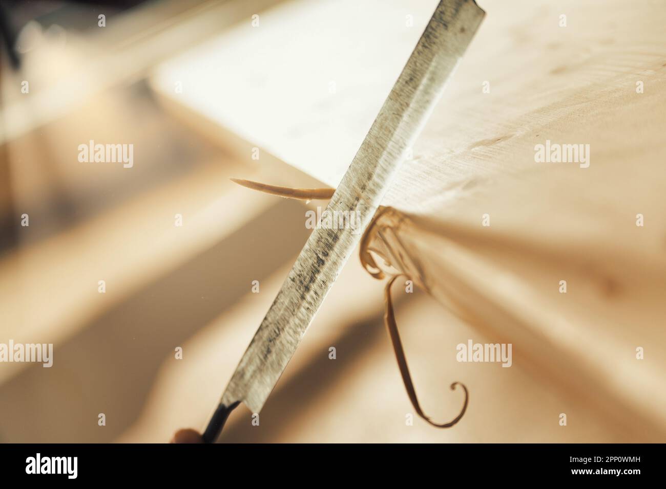 Detail of a hand-cutting blade notching the first corners of a board ...