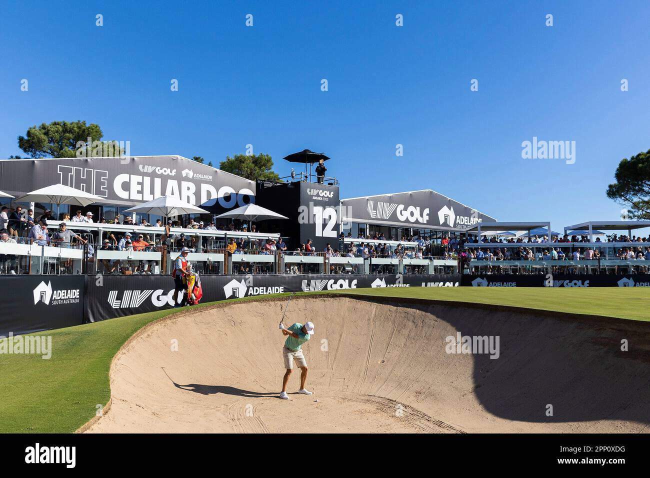 Matt Jones of Ripper GC hits his shot from a bunker on the 12th hole ...