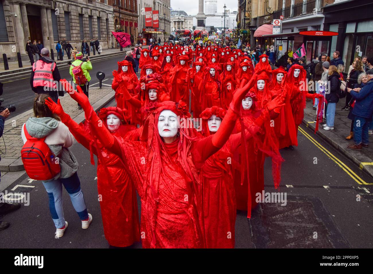 London, UK. 21st April 2023. Red Rebels pass through Parliament Square ...
