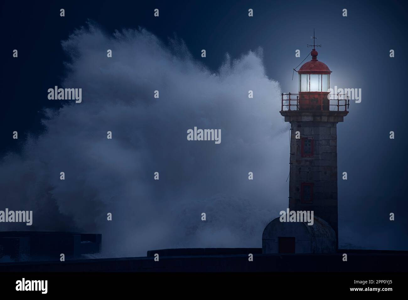 Old lighthouse under a heavy storm at night Stock Photo - Alamy